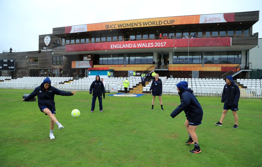 The New Zealand players indulge in some football on a sodden outfield ...