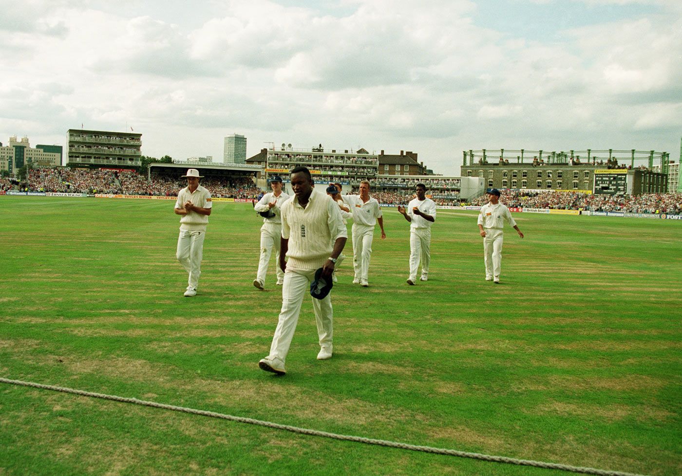 Devon Malcolm leads the team off the field | ESPNcricinfo.com