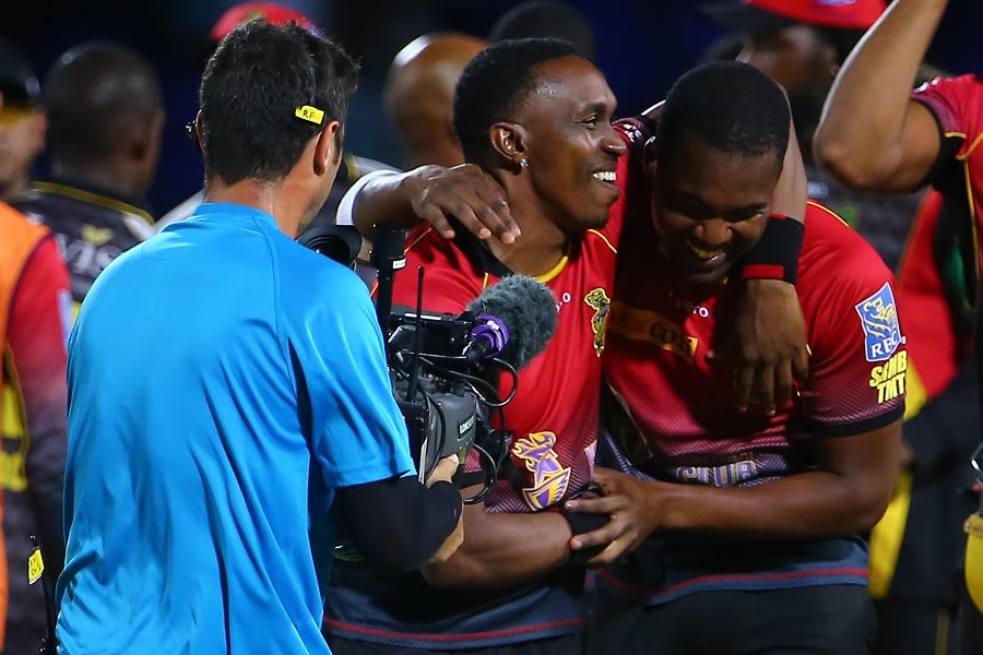 The captain Dwayne Bravo celebrates with his brother Darren Bravo ...