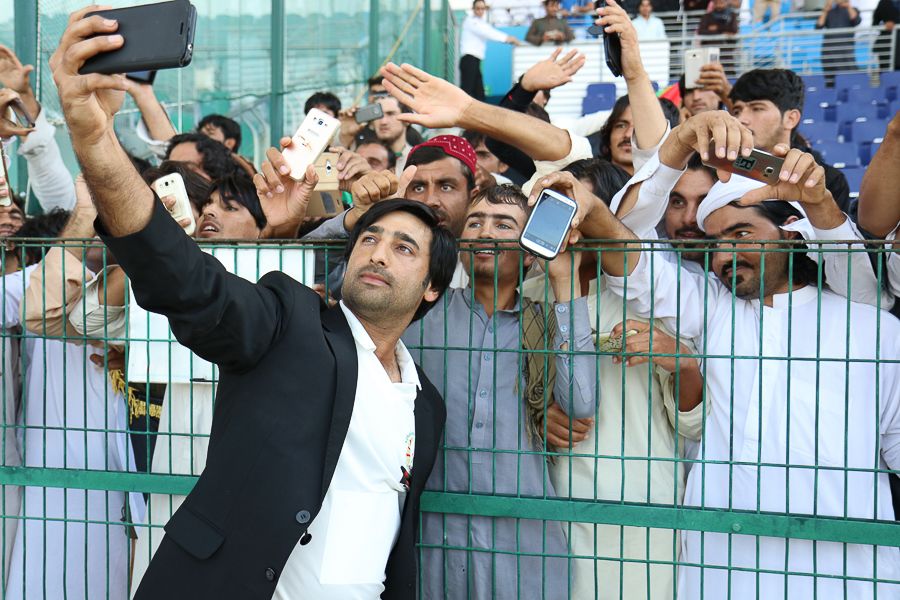 Captain Asghar Stanikzai celebrates by taking selfies with the fans ...
