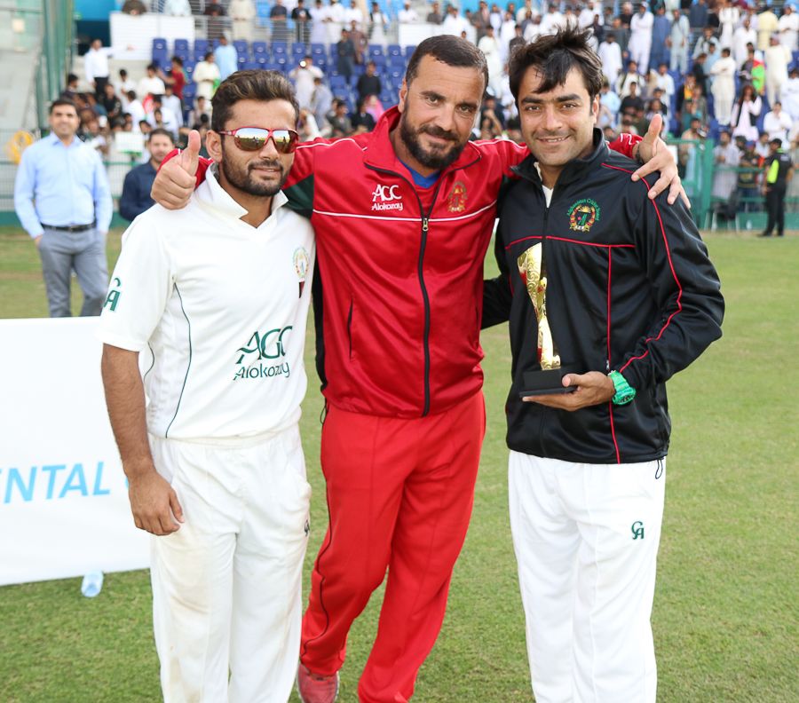 Zahir Khan, coach Raees Ahmadzai and Rashid Khan celebrate winning the ...
