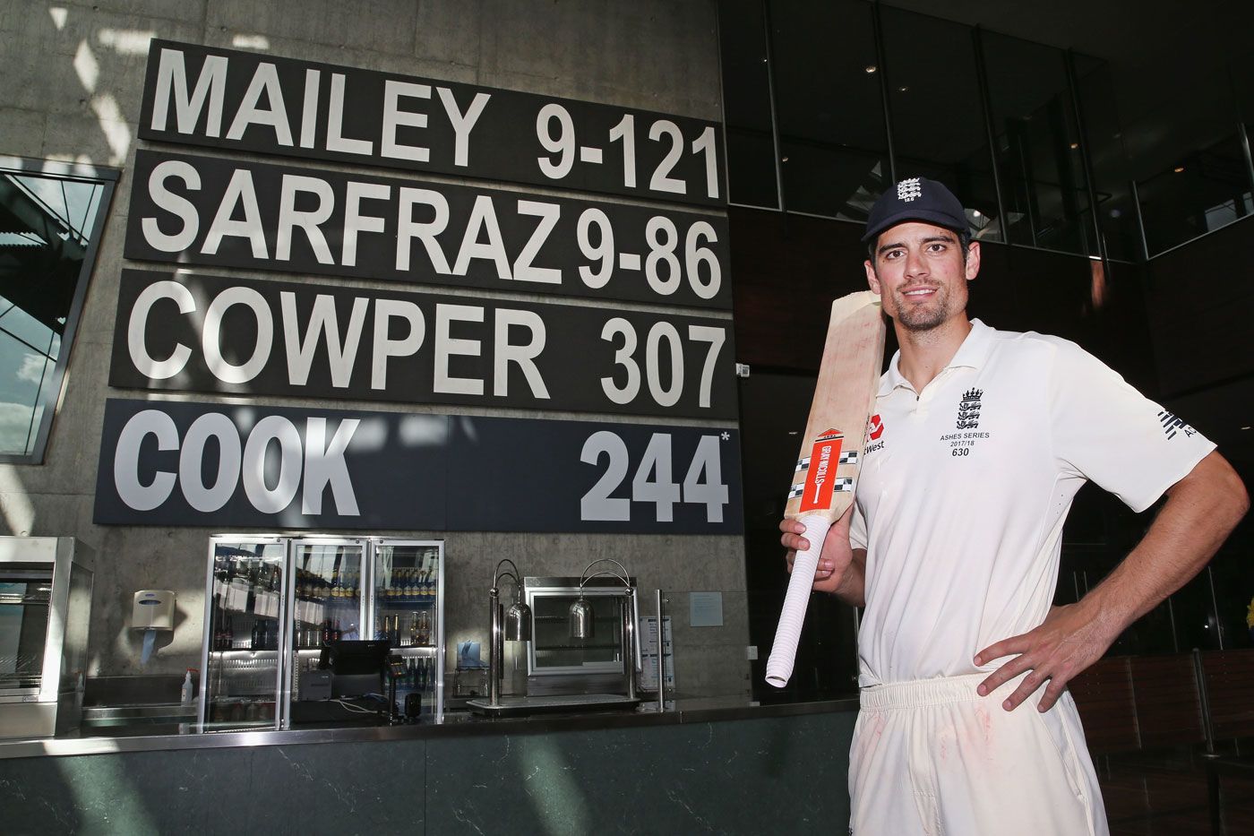 Alastair Cook poses with his name up on the wall at the MCG's Percy ...