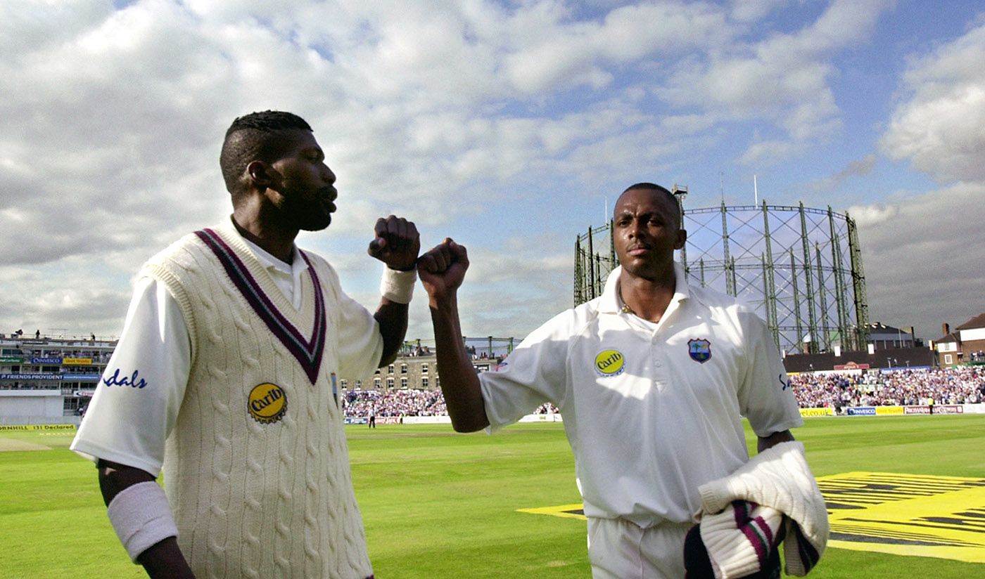 Curtly Ambrose and Courtney Walsh leave the field together in Ambrose's ...
