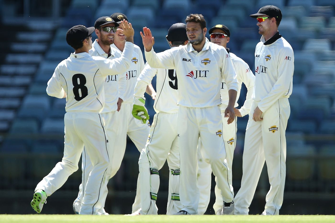 Usman Qadir Gets A High Five From His Team Mate