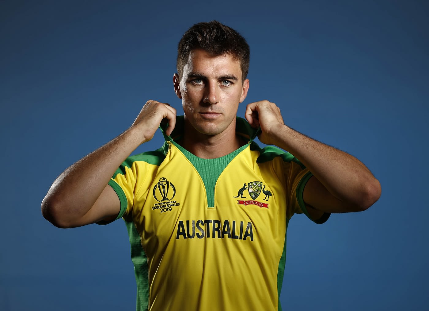 Pat Cummins poses during a photo session | ESPNcricinfo.com