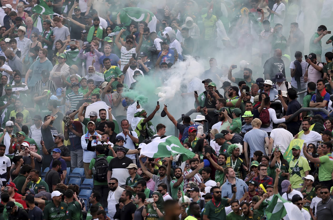 Pakistan fans celebrate their last-over win over Afghanistan that keeps ...