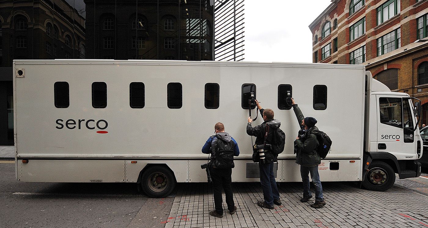 Camerapersons take photos of a prison van leaving the Southwark Crown ...