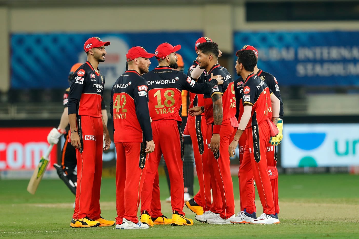The Royal Challengers Bangalore players celebrate the early wicket of ...