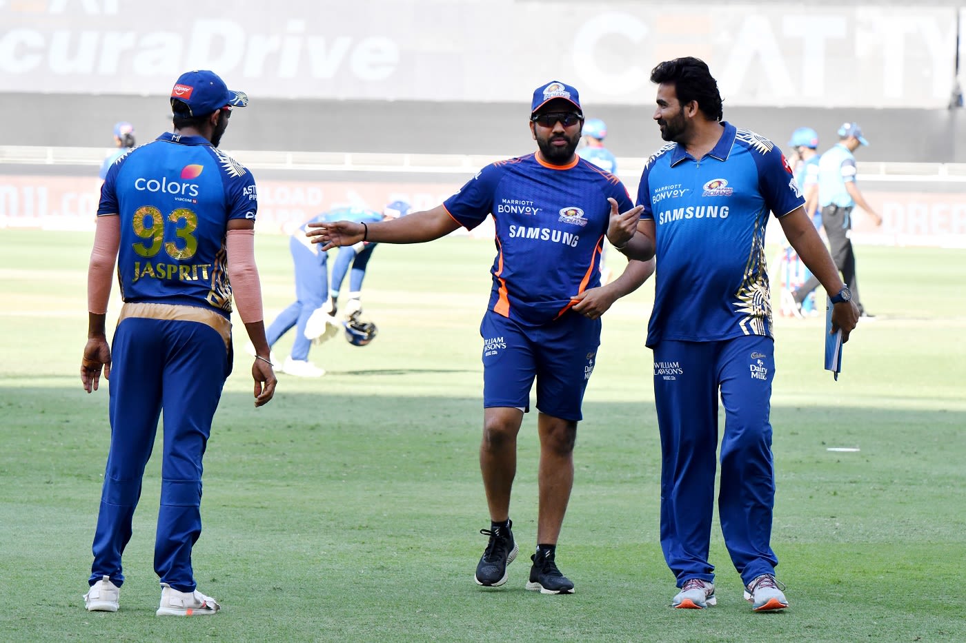 Rohit Sharma and Zaheer Khan share a light moment as Jasprit Bumrah looks on | ESPNcricinfo.com