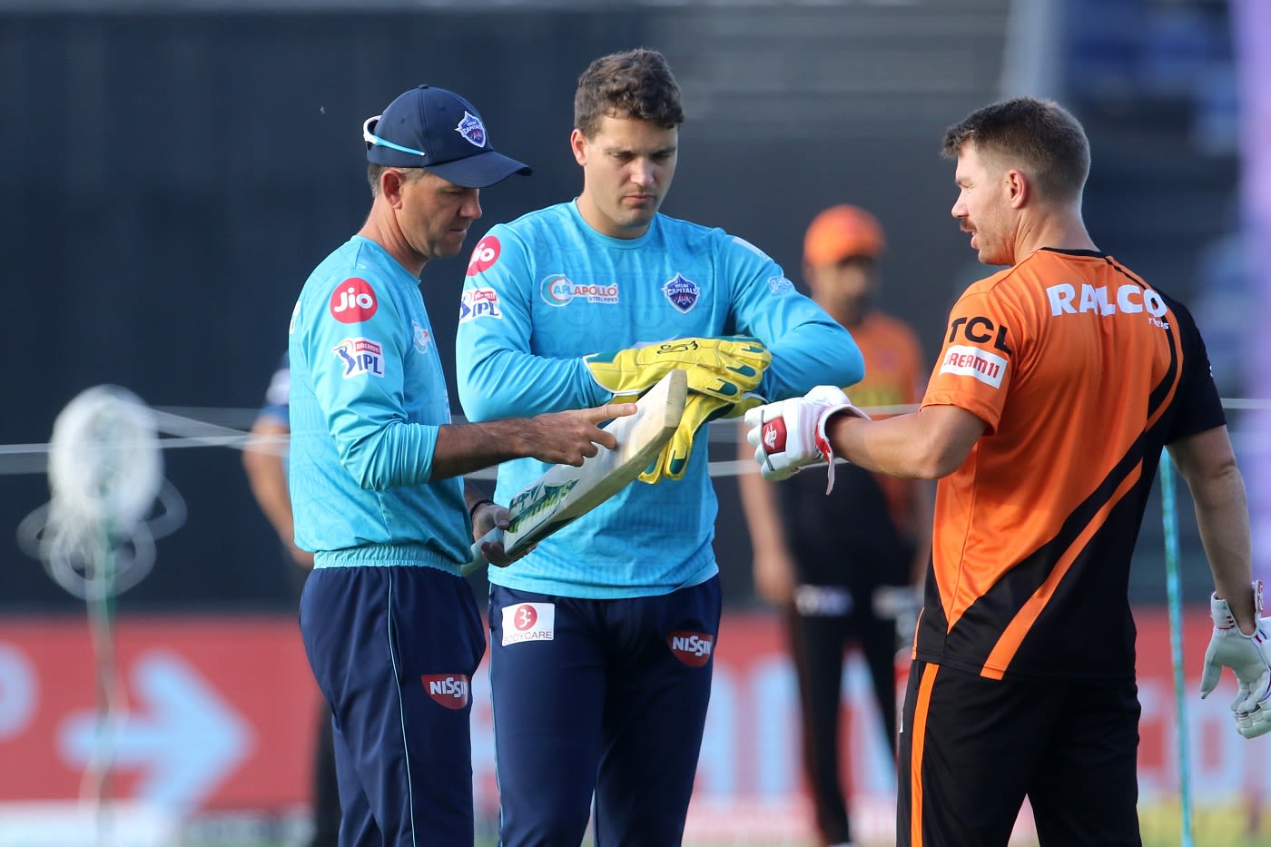 David Warner has a chat with Ricky Ponting and Alex Carey ...