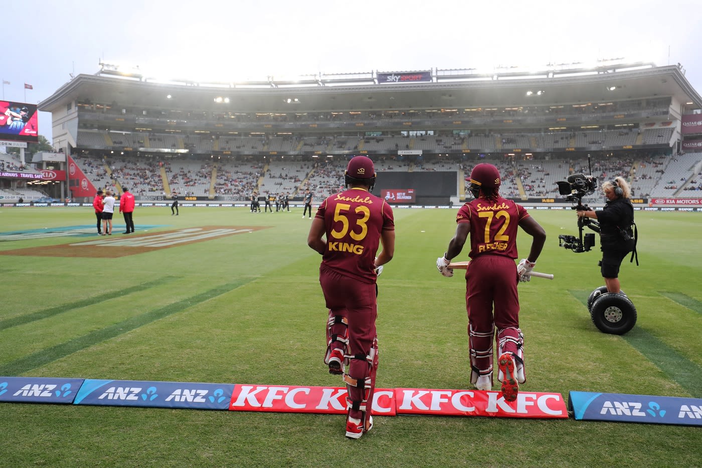 West Indies openers Brandon King and Andre Fletcher walk out to bat ...