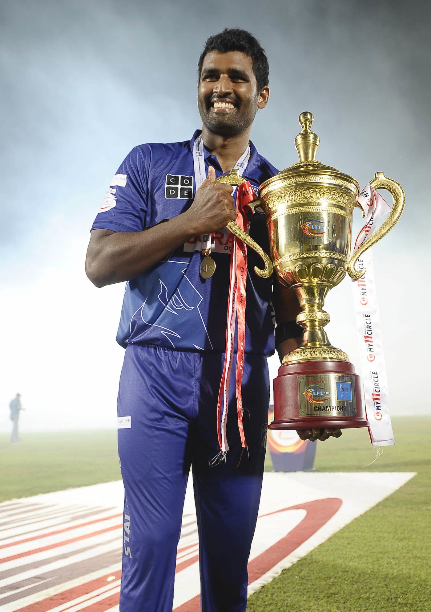 Jaffna Stallions captain Thisara Perera is all smiles with the trophy | ESPNcricinfo.com