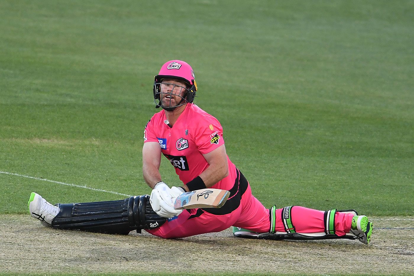 Dan Christian gets into an awkward position as he sweeps | ESPNcricinfo.com