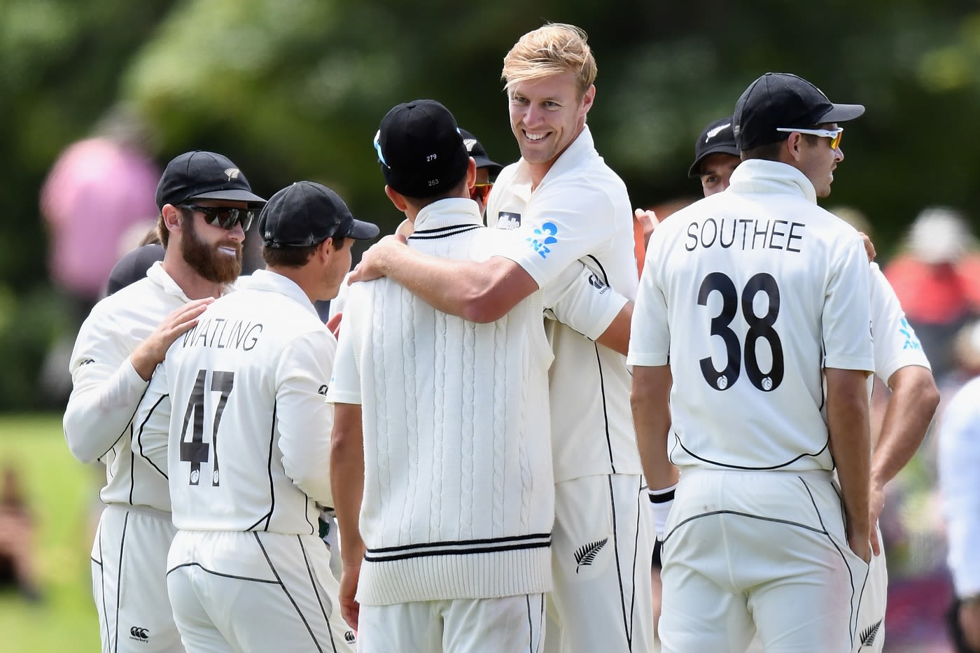 All smiles: Kyle Jamieson celebrates a wicket with his team-mates ...