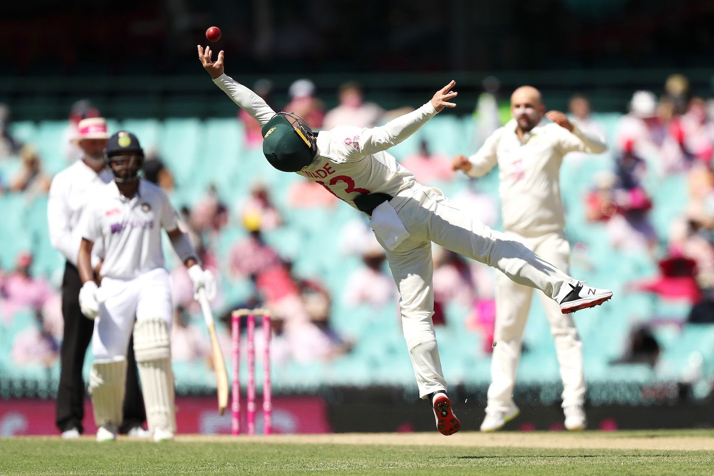 Matthew Wade leaps to try and catch the ball at short leg ...