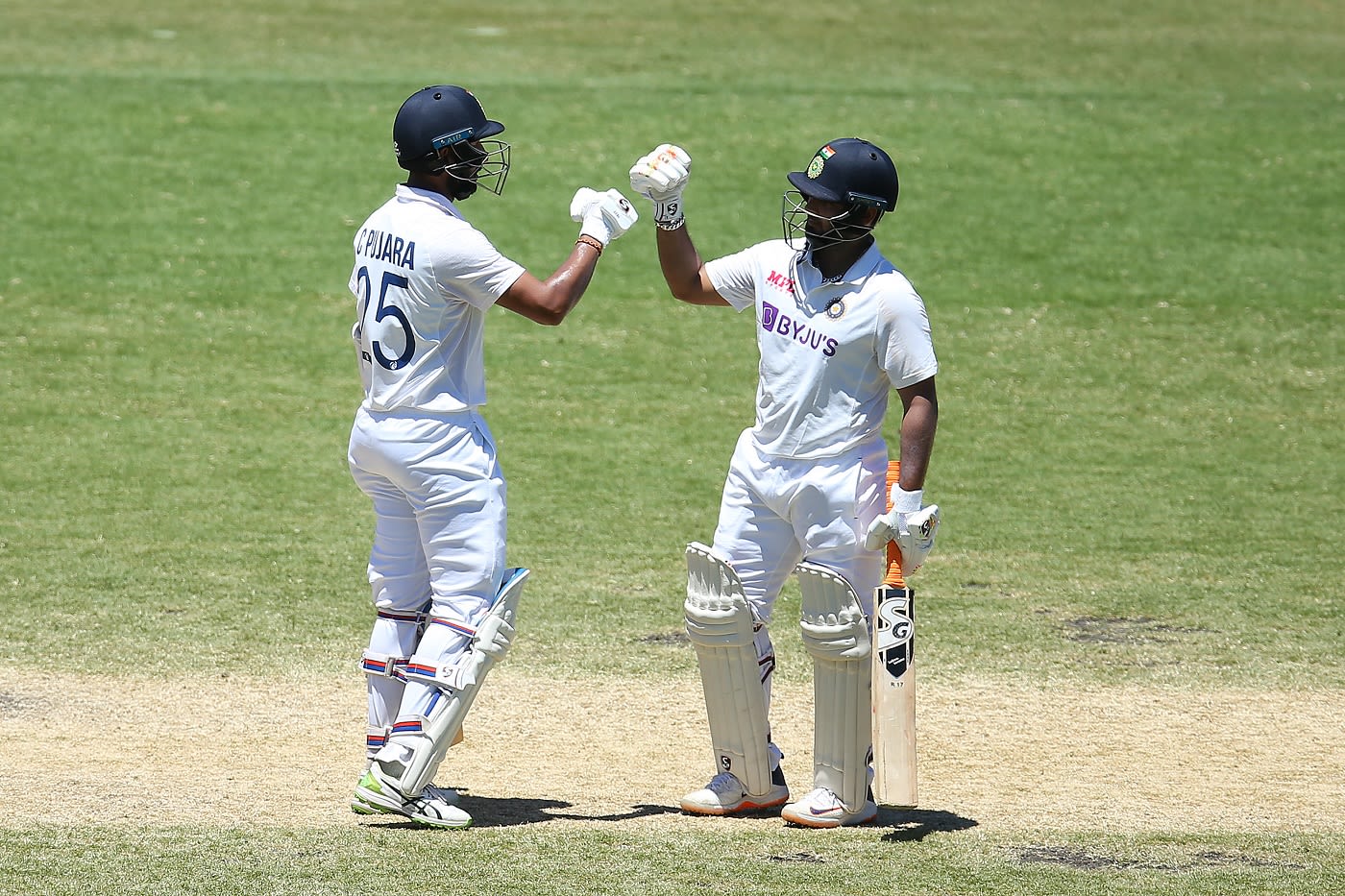 Cheteshwar Pujara and Rishabh Pant bump fists during their partnership ...