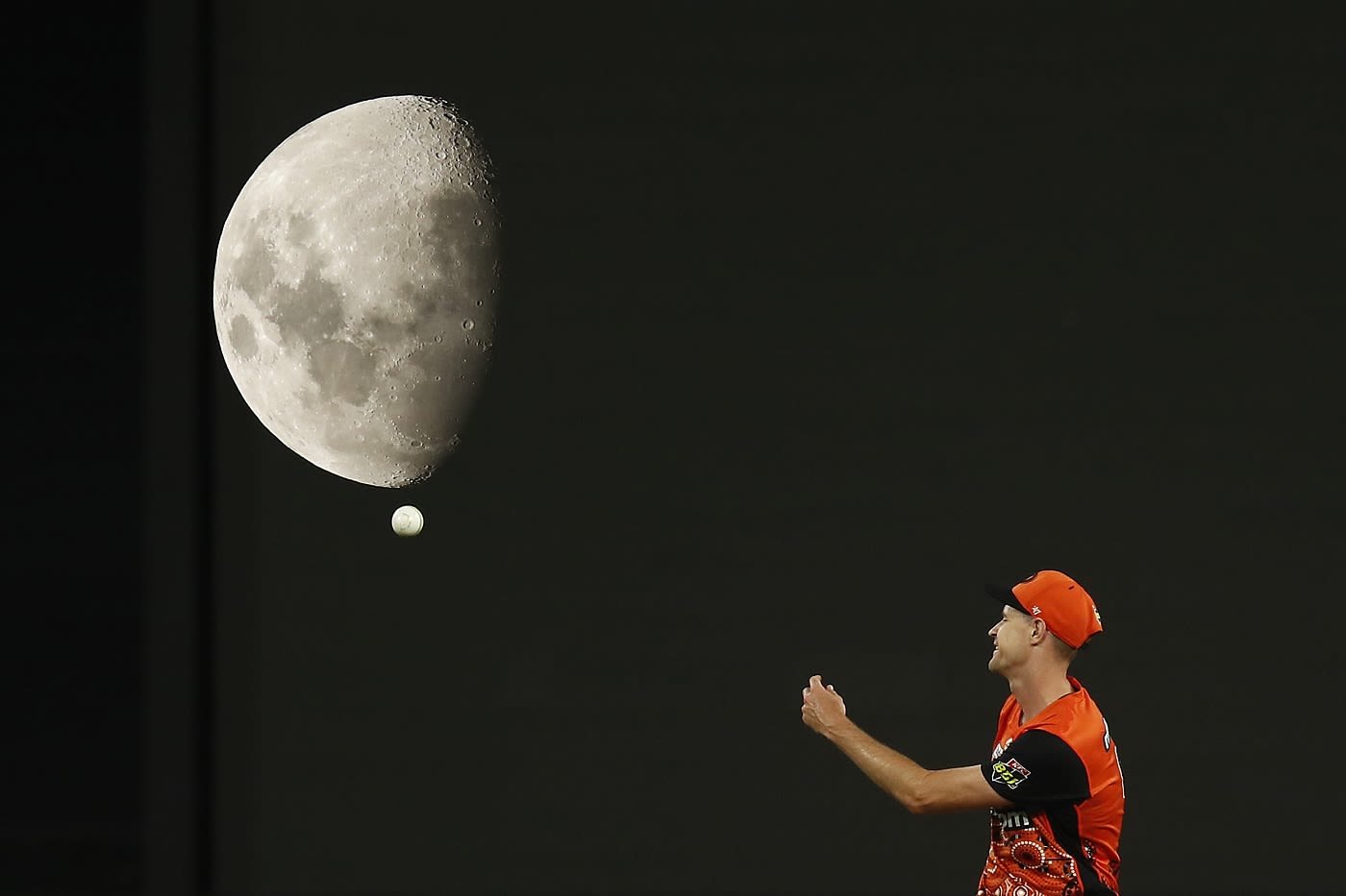 A multiple-exposure image of Jason Behrendorff receiving the ball with ...