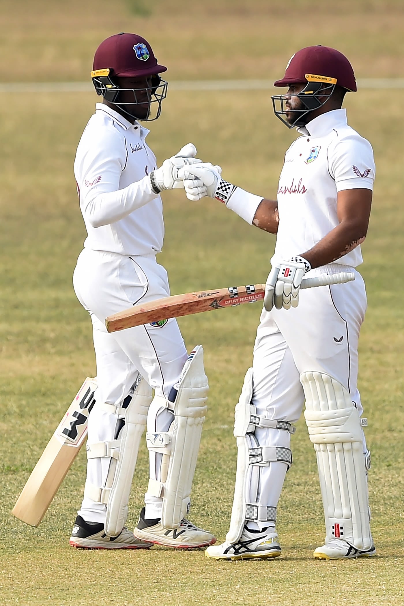 Nkrumah Bonner and John Campbell bump fists during their 129-run stand ...