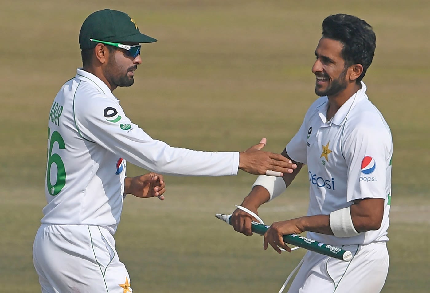 Pakistan captain Babar Azam congratulates Hasan Ali on his ten-for ...