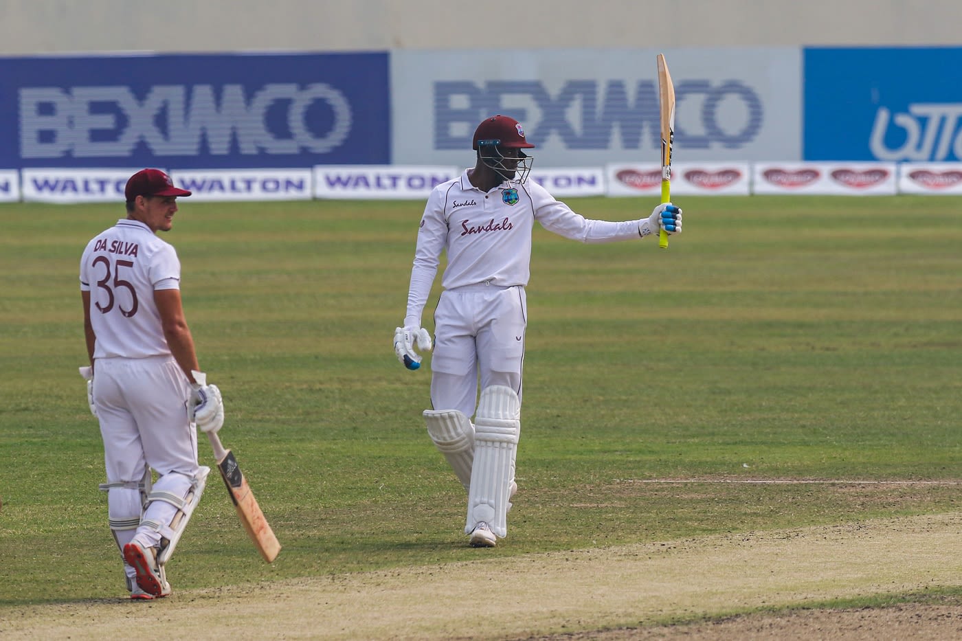 Alzarri Joseph celebrates his half-century as Joshua Da Silva looks on ...