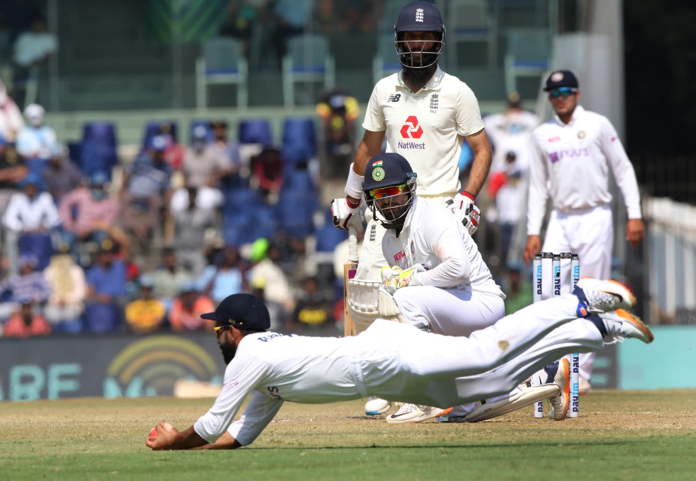 Ajinkya Rahane completes a diving catch to see the end of Moeen Ali ...