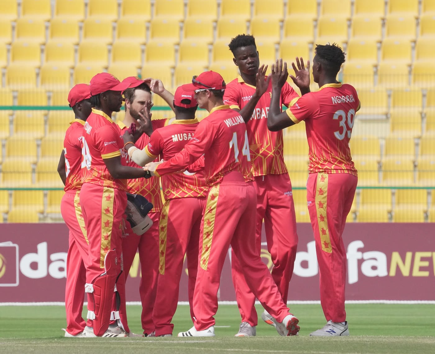 The Zimbabwe players get together after Karim Janat's fall ...