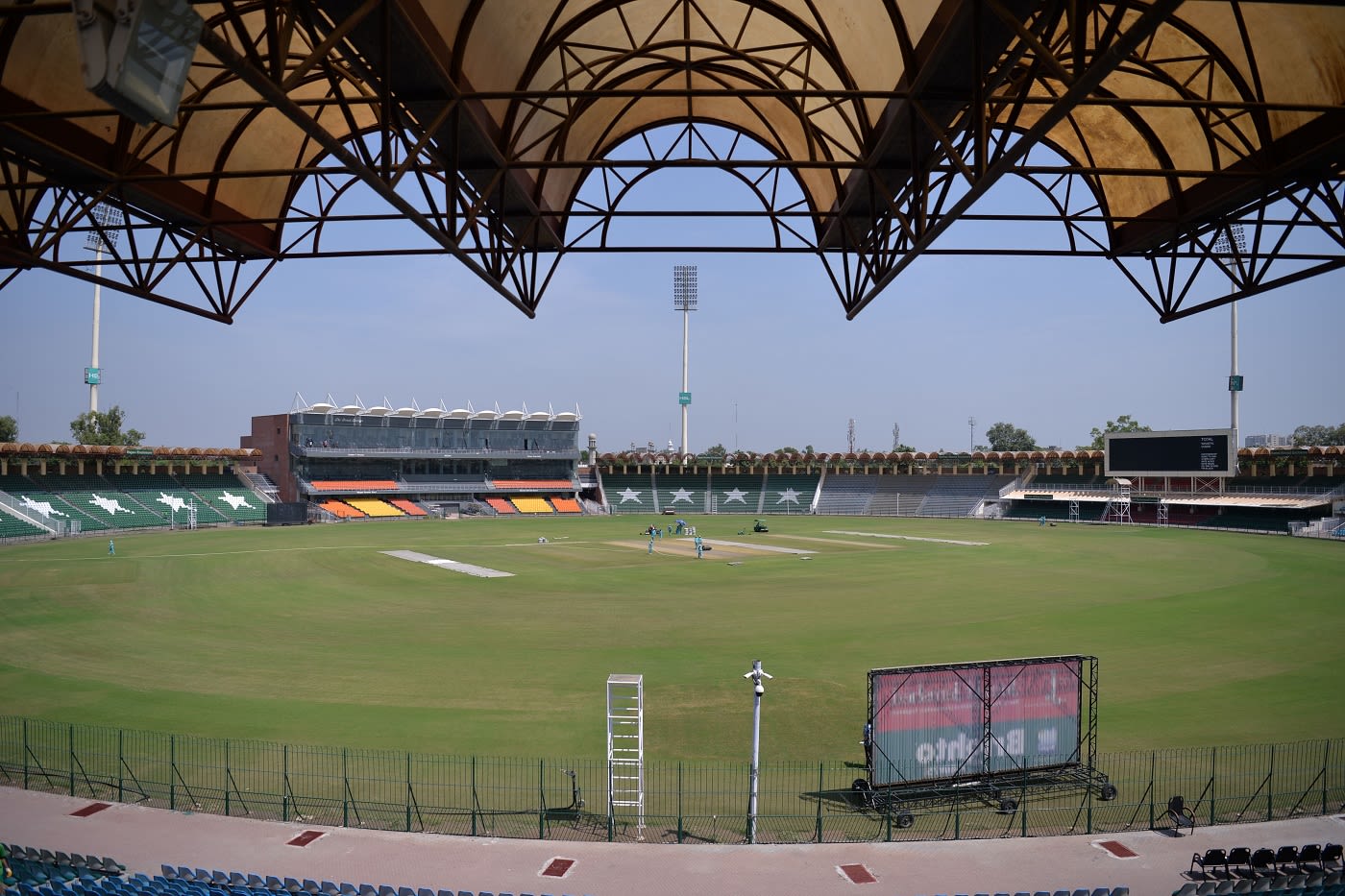 Ground staff prepare the pitch of the Gaddafi Stadium | ESPNcricinfo.com