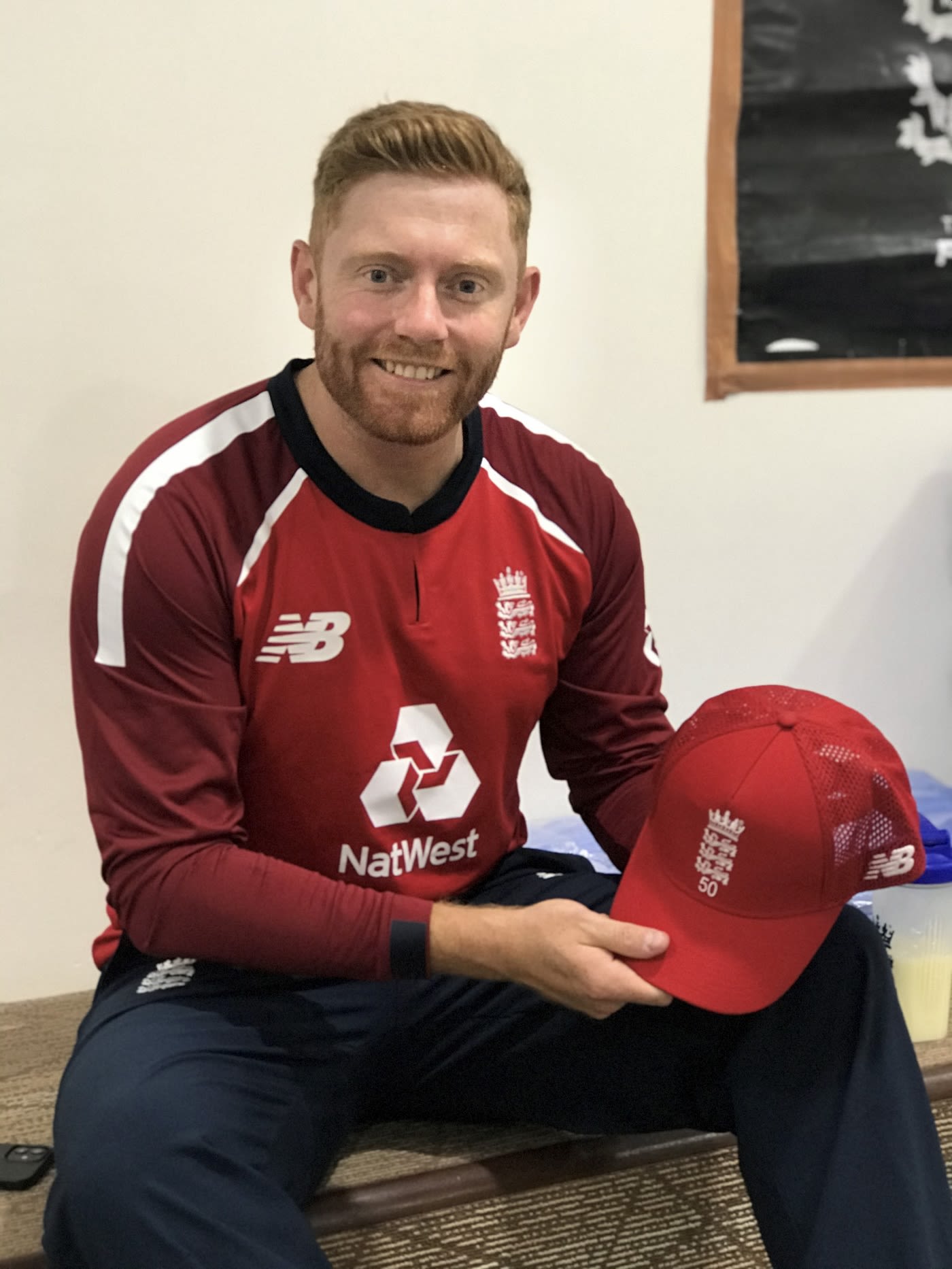 Jonny Bairstow poses with the special cap presented to him before his ...