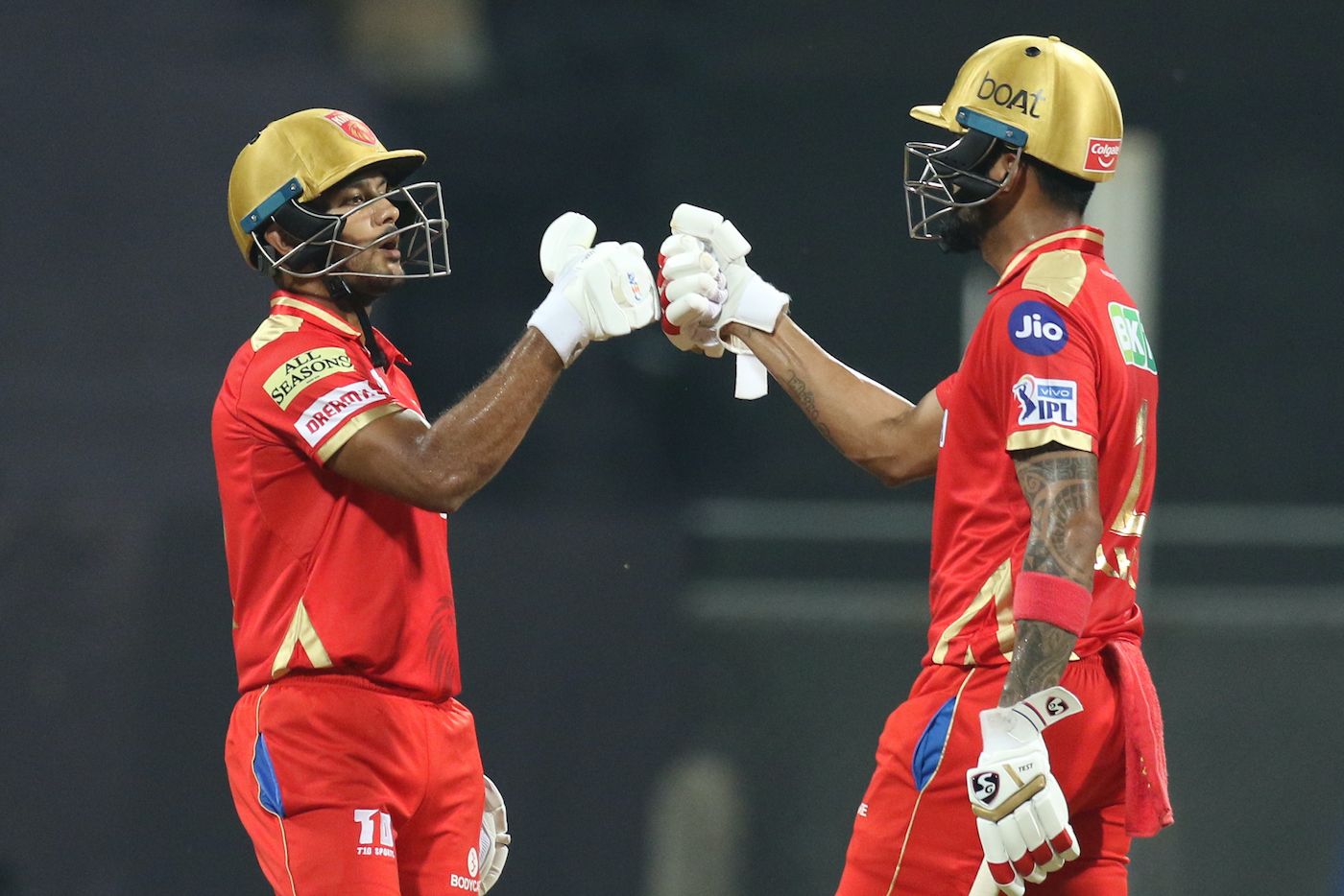 Mayank Agarwal and KL Rahul punch gloves during their attacking ...