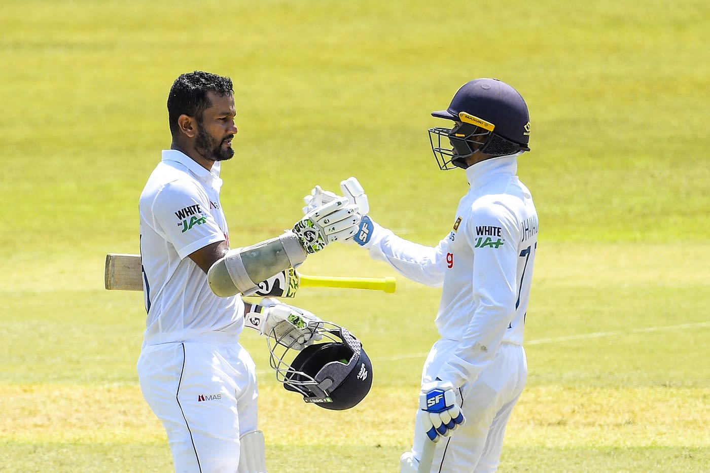 Dimuth Karunaratne is congratulated by Dhananjaya de Silva ... Dimuth Karunaratne is congratulated by Dhananjaya de Silva ...