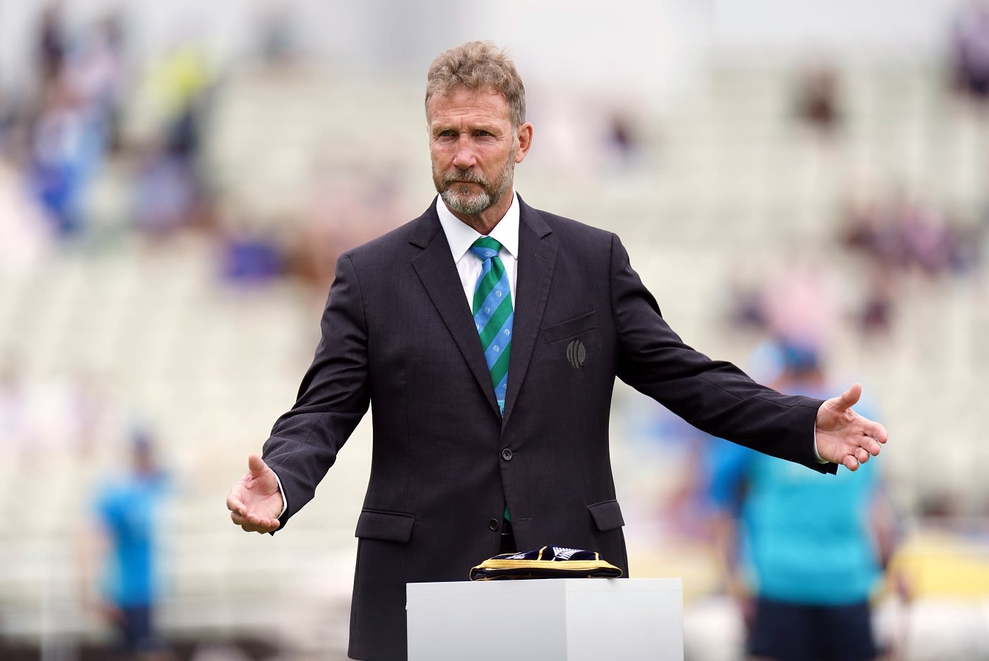 Match referee Chris Broad gestures during the coin toss | ESPNcricinfo.com