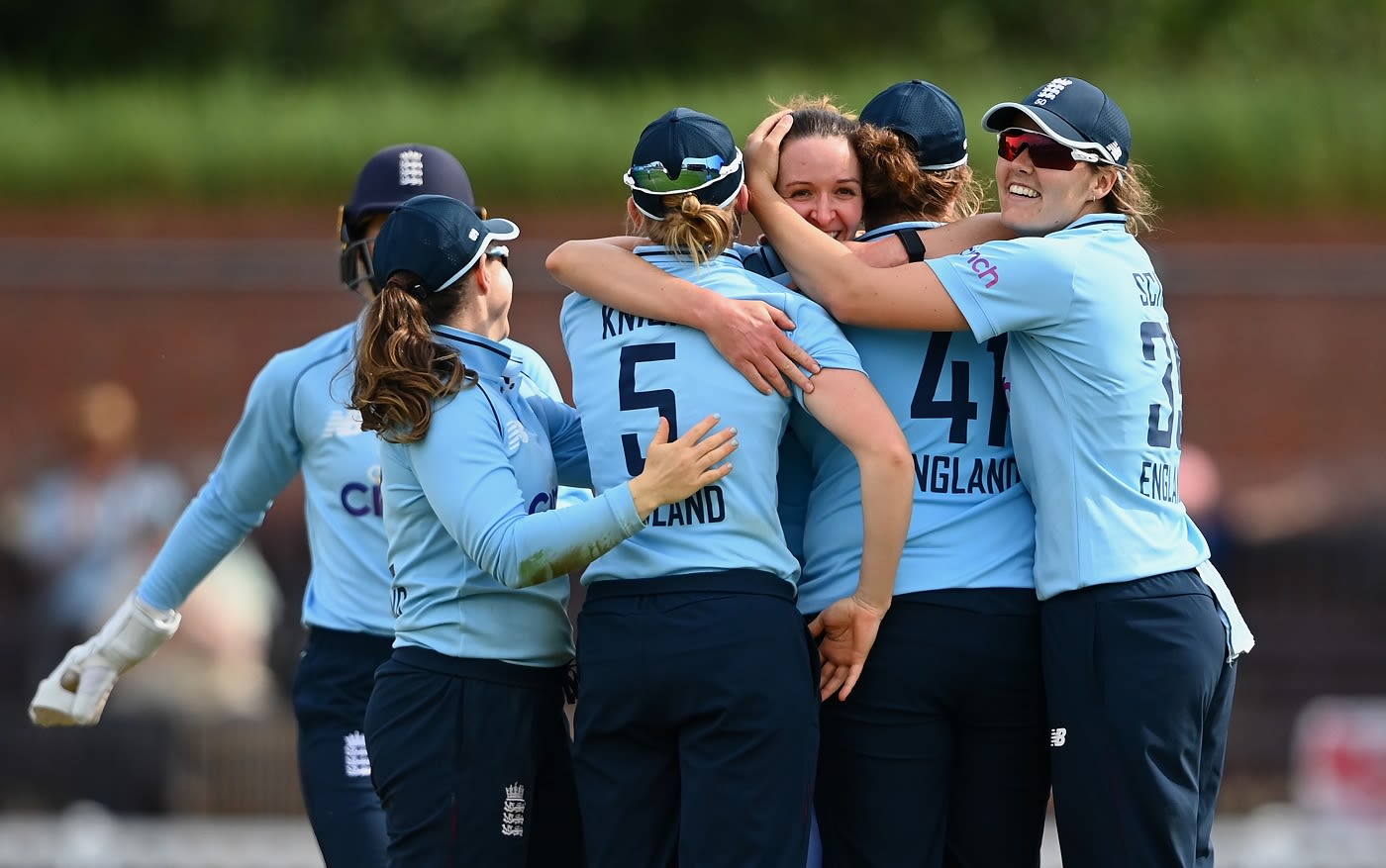 Kate Cross is being congratulated by her team-mates after picking up a ...