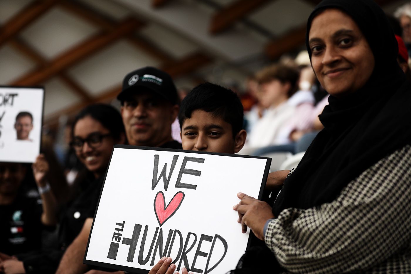 Spectators hold up a "We love the Hundred" sign | ESPNcricinfo.com