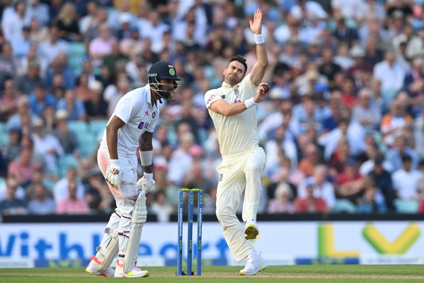 James Anderson runs in to bowl, with KL Rahul at the non-striker's end ...