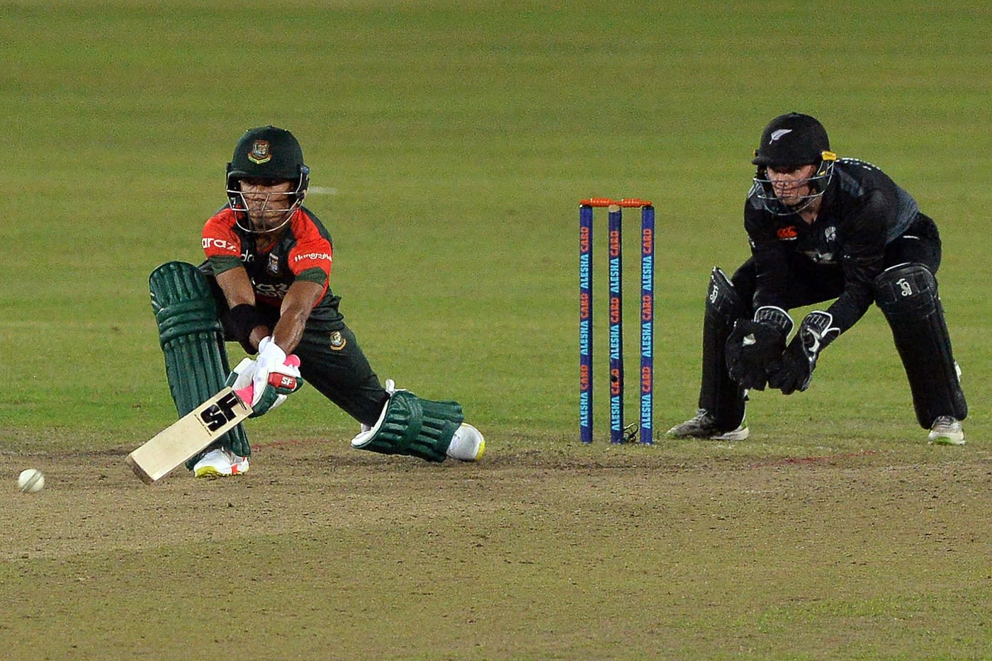 Afif Hossain stretches out for a reverse-sweep | ESPNcricinfo.com