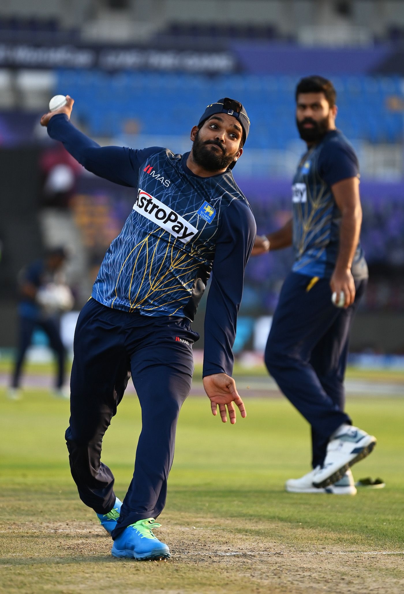 Wanindu Hasaranga has a bowl before the start of the game ...