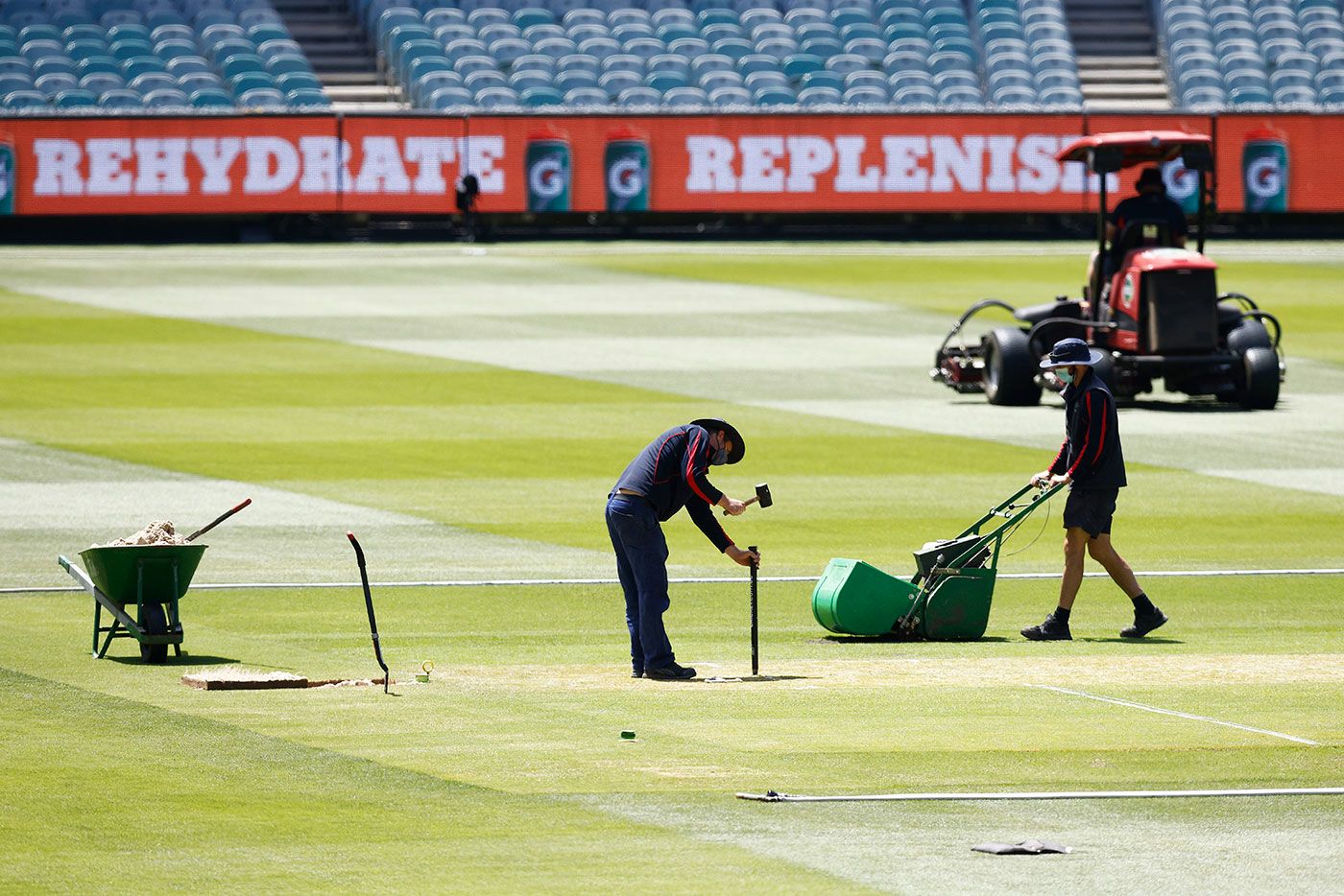 Groundstaff make their final preparations to the Boxing Day pitch ...