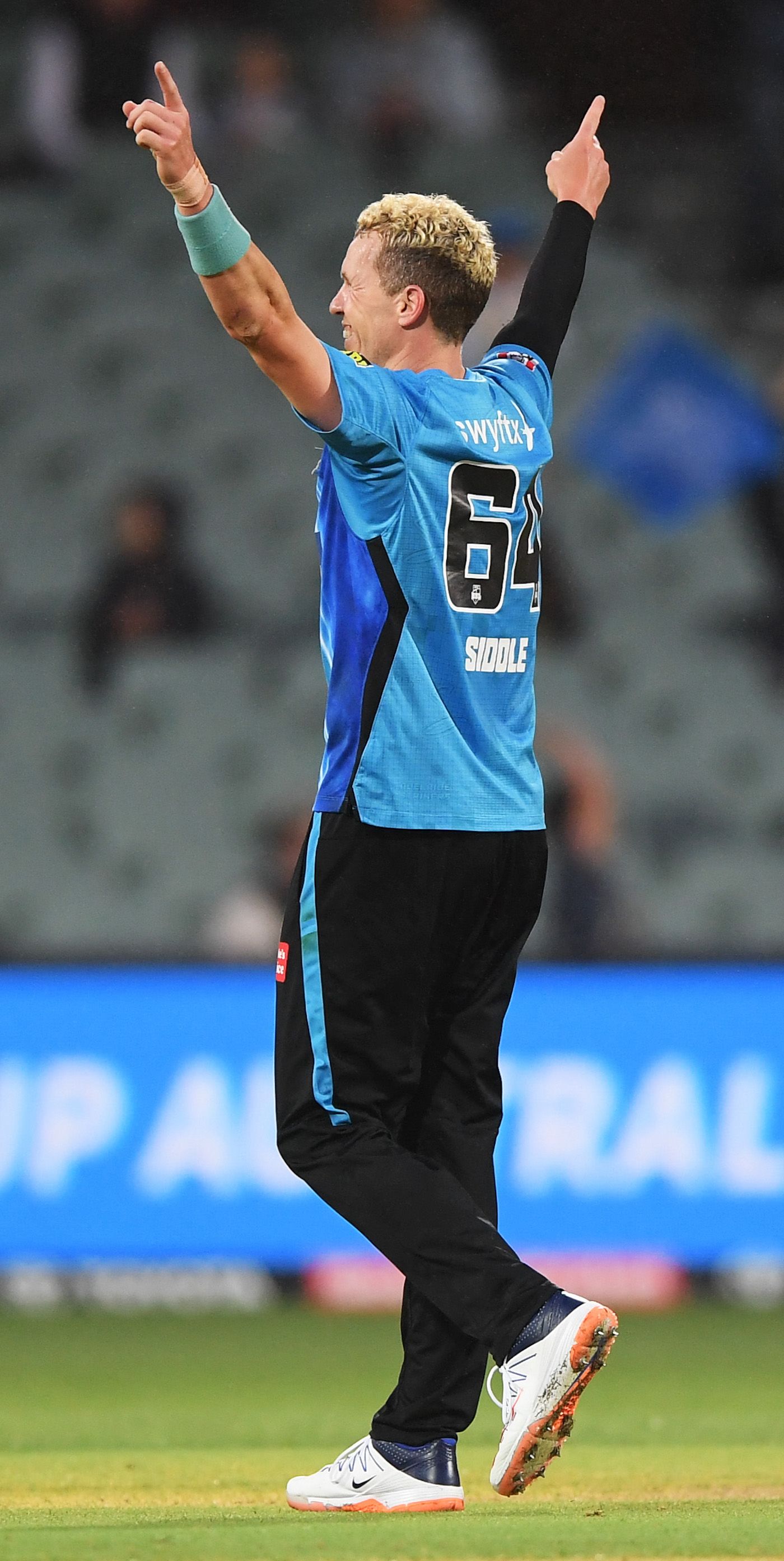 Peter Siddle sports a big smile after picking up a wicket ...