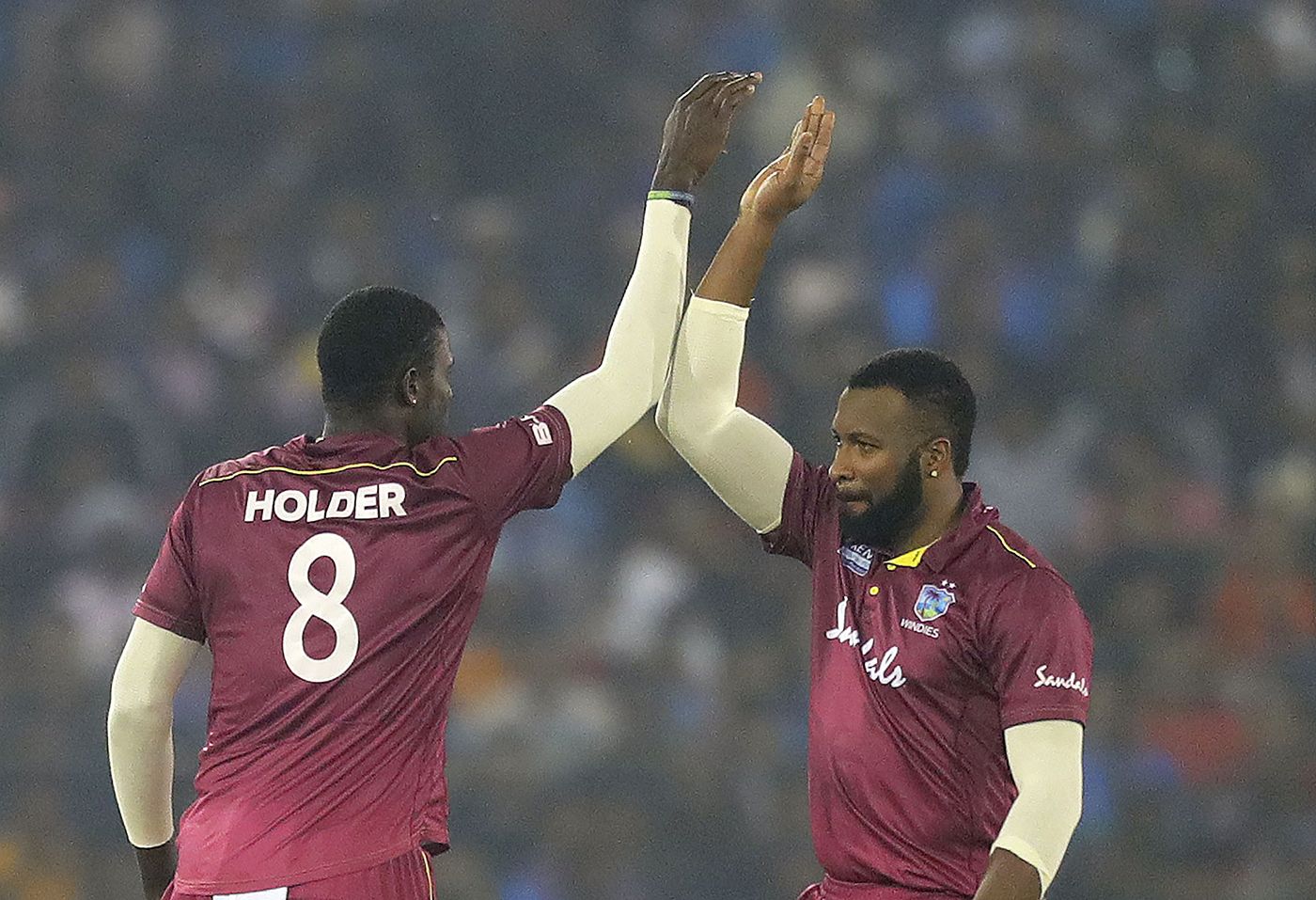 Kieron Pollard and Jason Holder celebrate | ESPNcricinfo.com