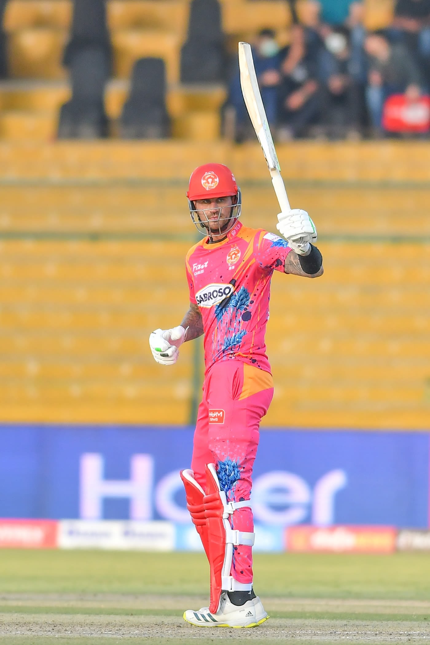 Alex Hales raises the bat after reaching his fifty | ESPNcricinfo.com