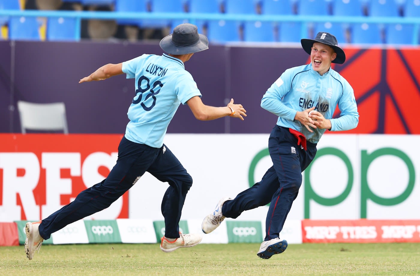 James Rew completes a catch in the deep and celebrates with Will Luxton ...