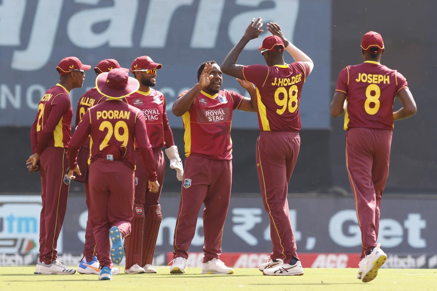 Odean Smith is congratulated by his team-mates after a wicket ...