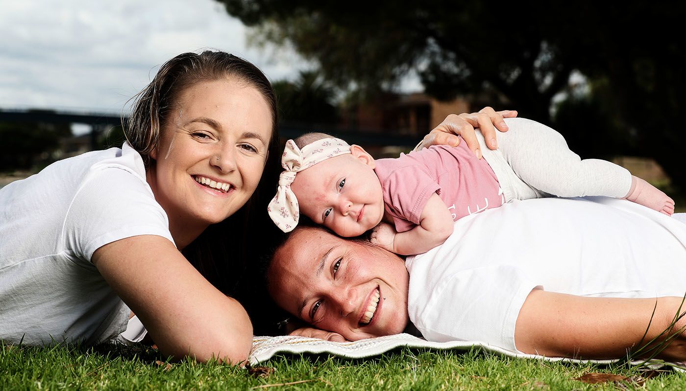 Megan Schutt (right) poses for photos with her wife Jess and baby ...