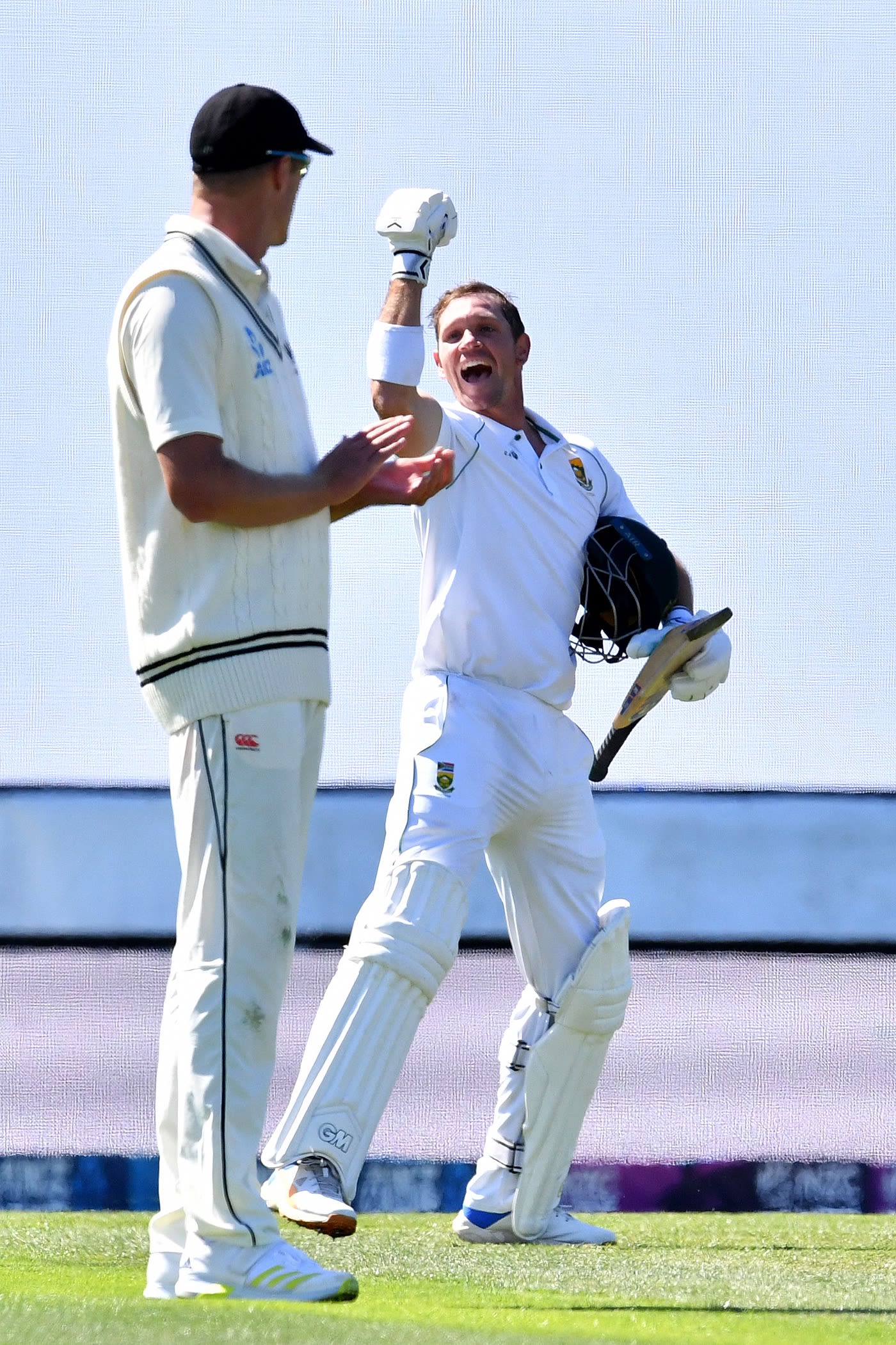 Sarel Erwee punches in the air after reaching his century ...