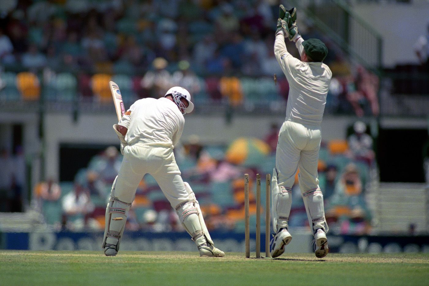 Alec Stewart looks back to see he has been bowled by Shane Warne ...