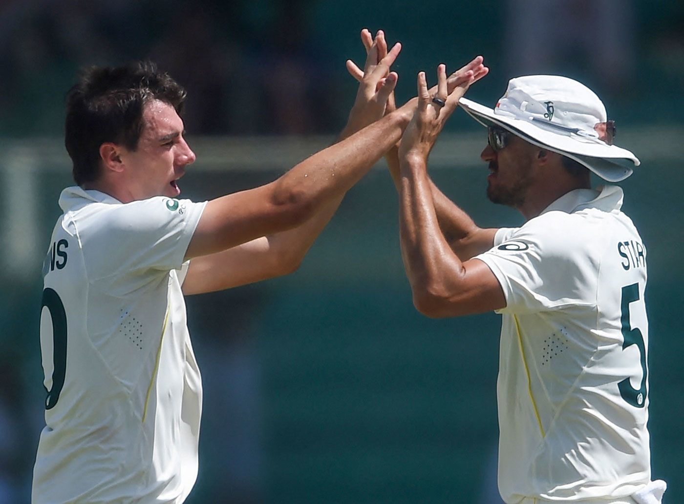 Pat Cummins celebrates with Mitchell Starc | ESPNcricinfo.com