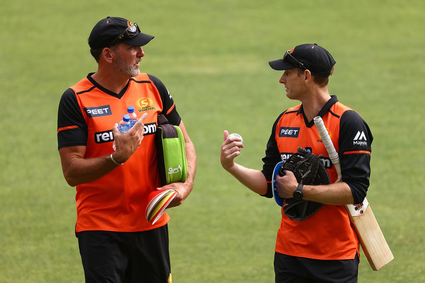 Matt Mason (left) chats to Perth Scorchers coach Adam Voges ...