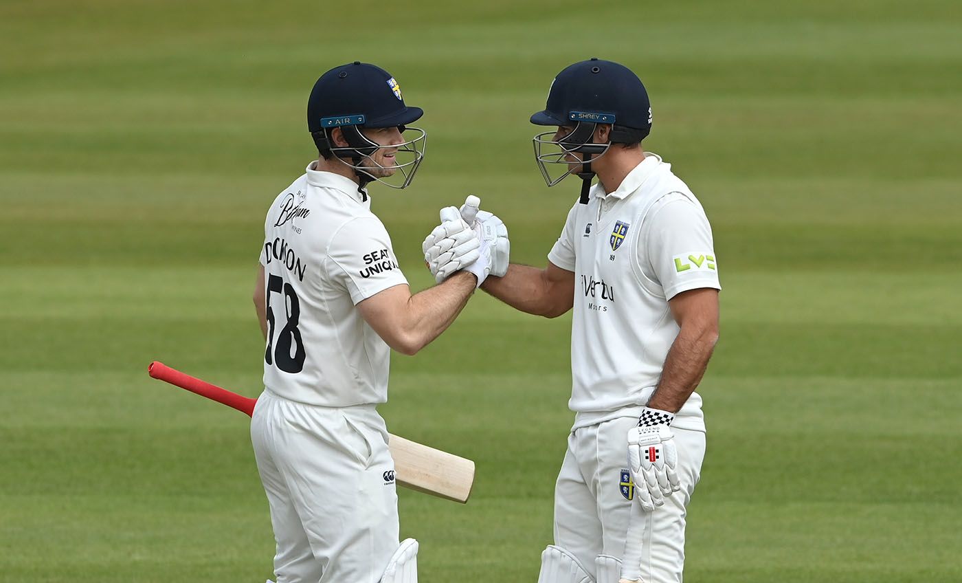 Sean Dickson congratulates David Bedingham on reaching his half-century ...