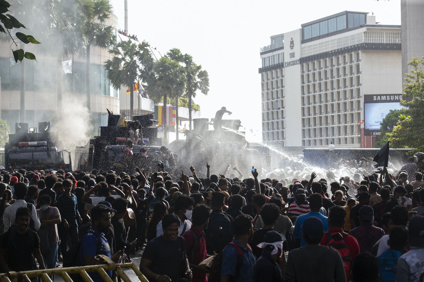 Sri Lankan riot police officers fire tear gas and water cannons at ... Sri Lankan riot police officers fire tear gas and water cannons at ...