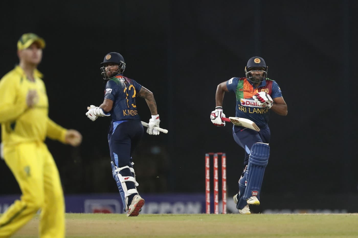 Kusal Mendis and Bhanuka Rajapaksa watch the ball as they run during ...